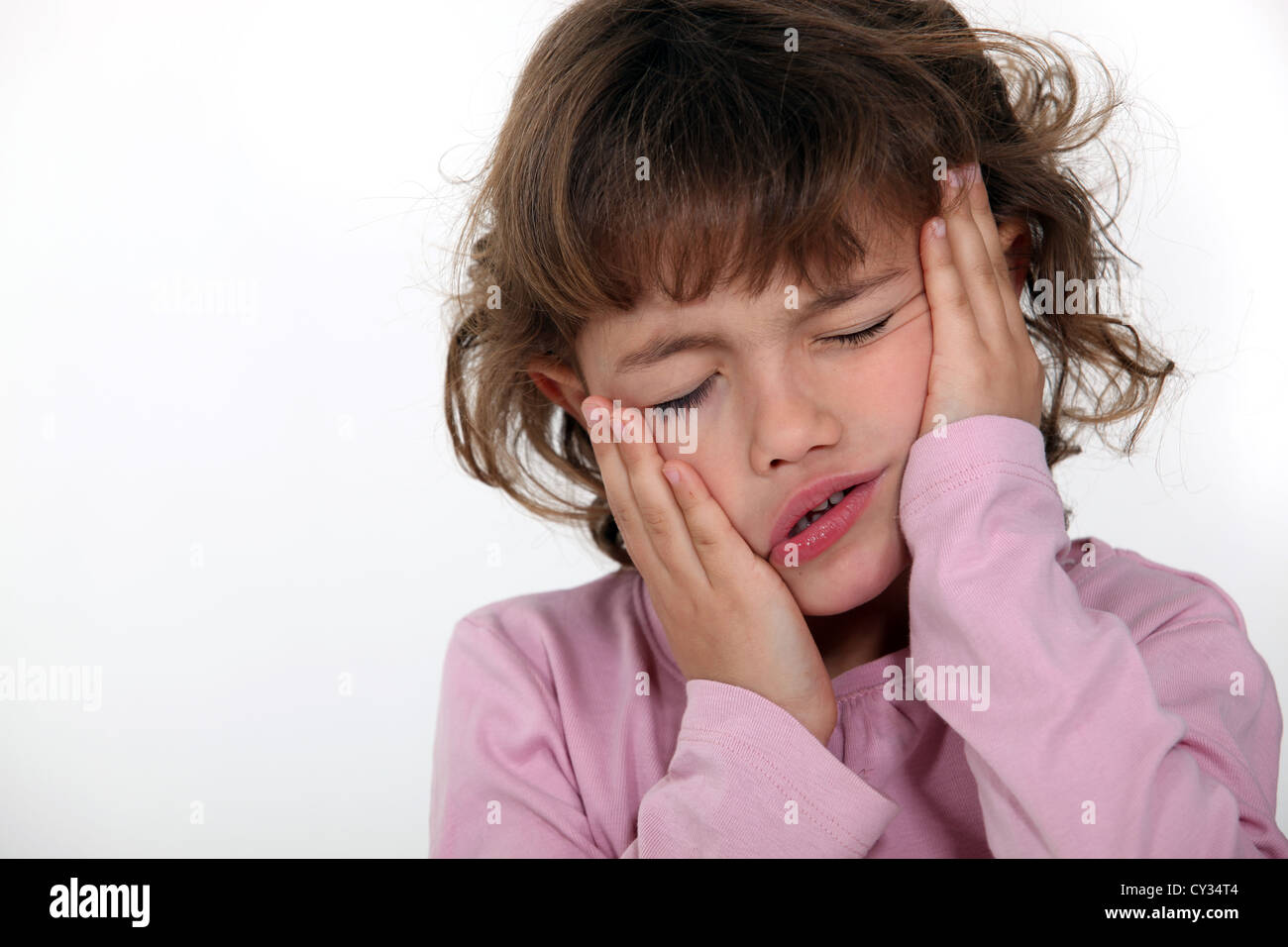 Girl clutching her face Stock Photo - Alamy