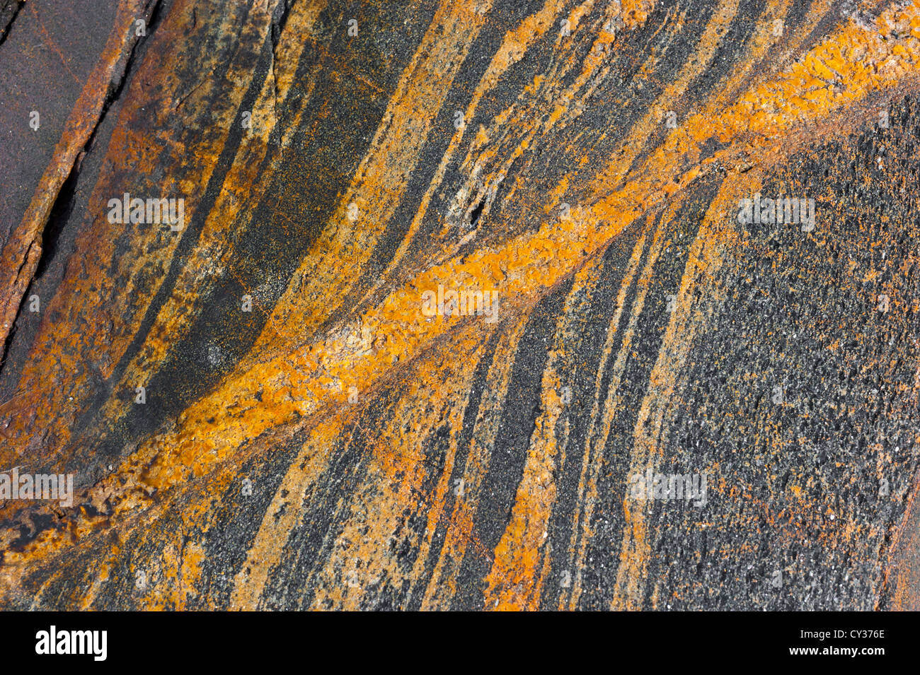 Different patterns of yellow streaks in lava rock Stock Photo - Alamy