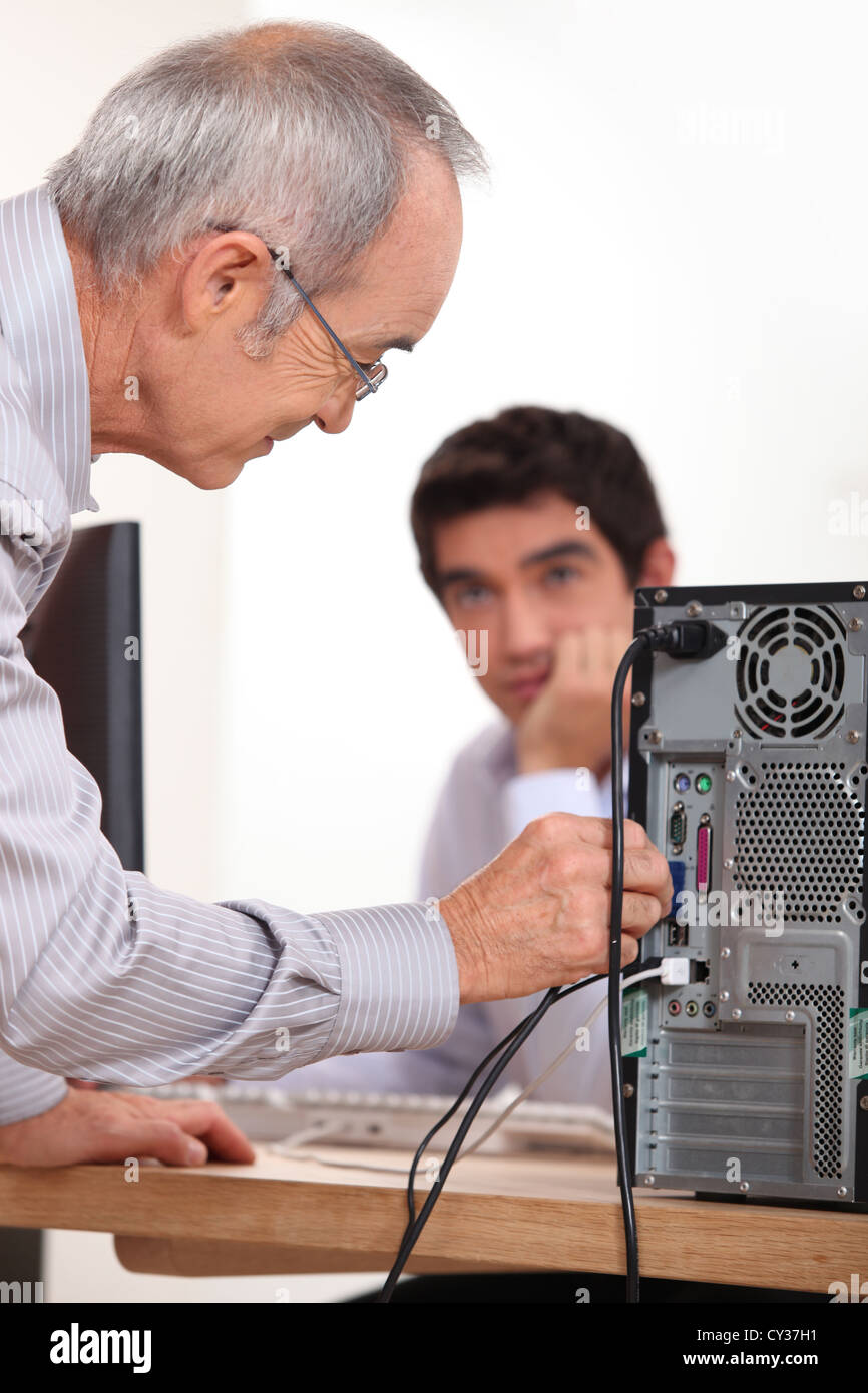 Plugging lan cable port hand hi-res stock photography and images - Alamy