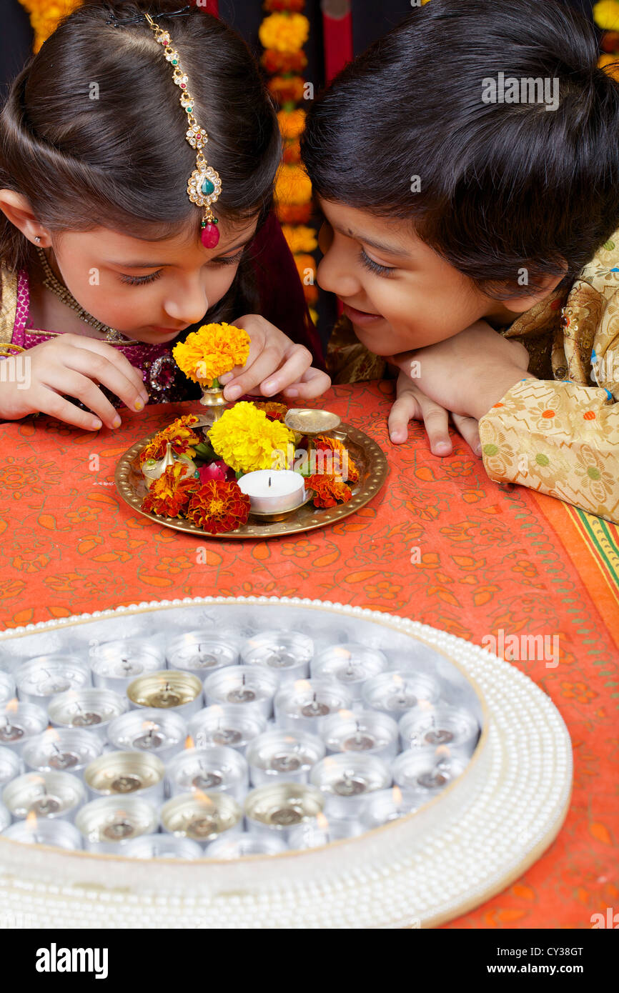 A young boy and girl celebrate on the festive occasion of Diwali Stock ...