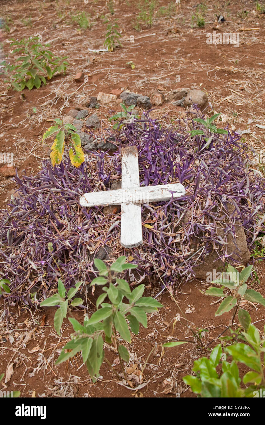 Simple burial ground with white cross in Tanzania;African burial ground ...