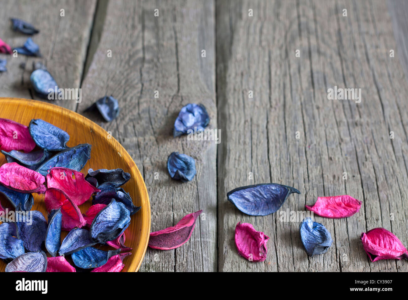 Dried petals in bowl spa concept on wooden boards background Stock ...
