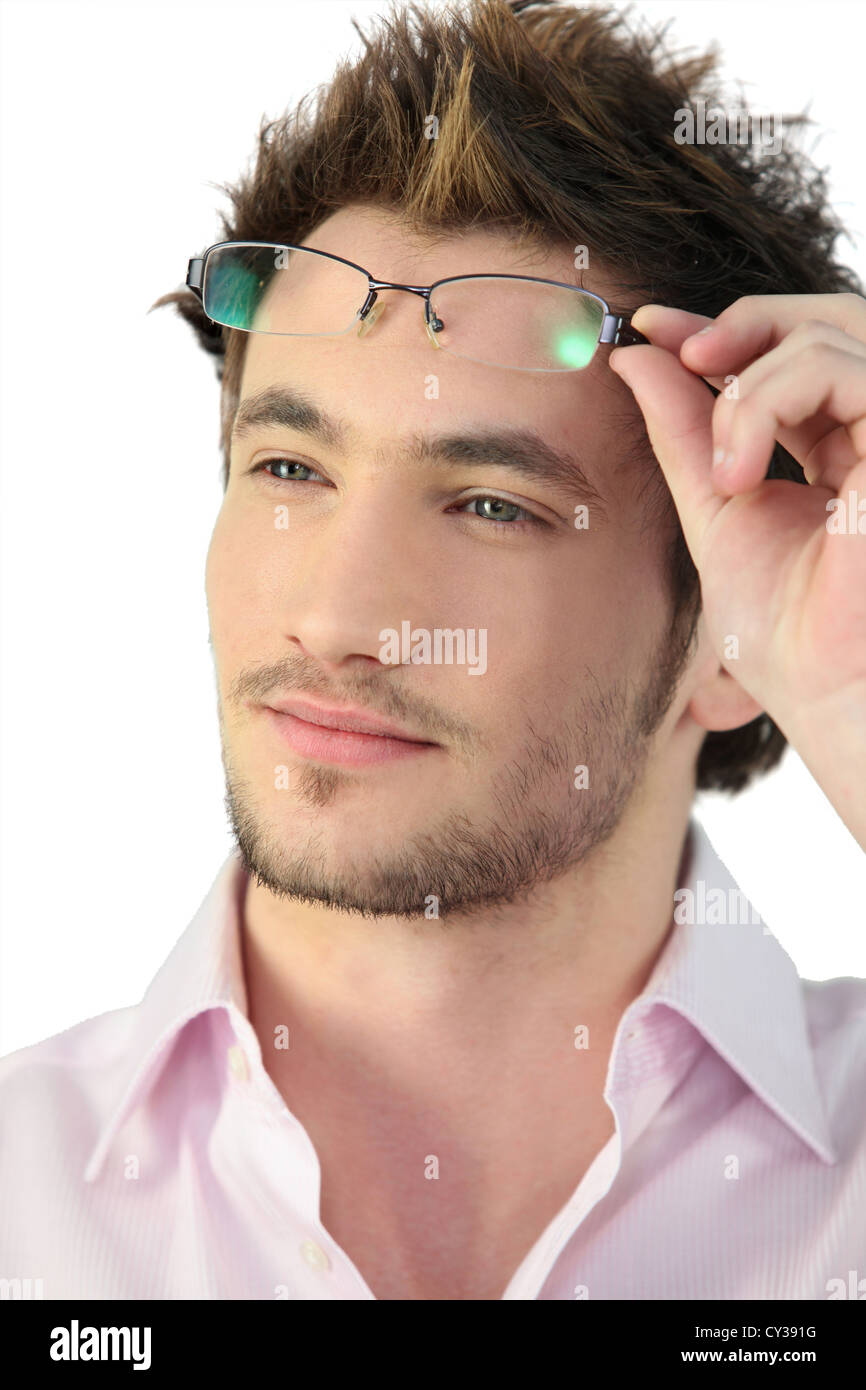 Portrait of young man wearing eyeglasses Stock Photo - Alamy