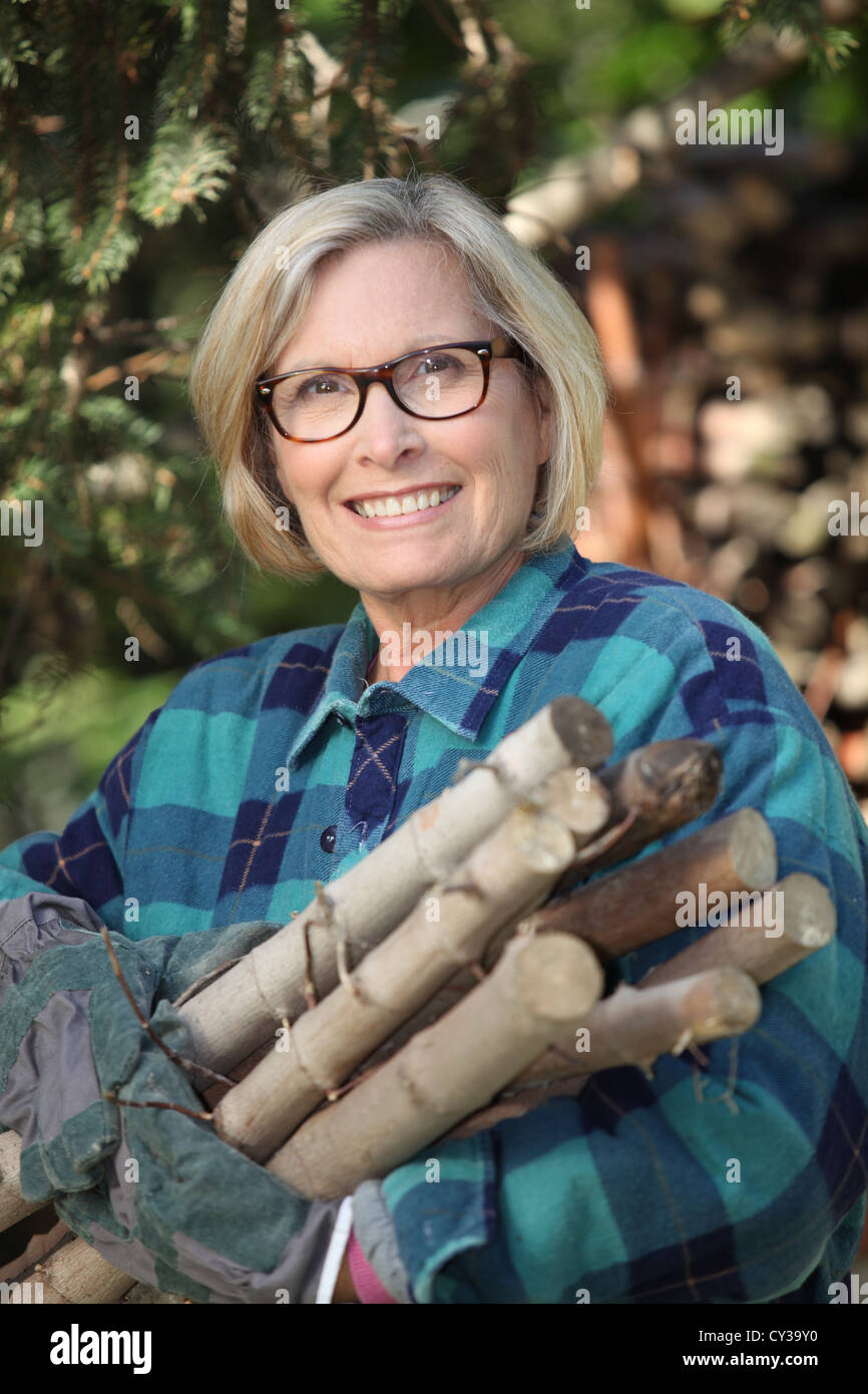 Old woman carrying kindling hi-res stock photography and images - Alamy