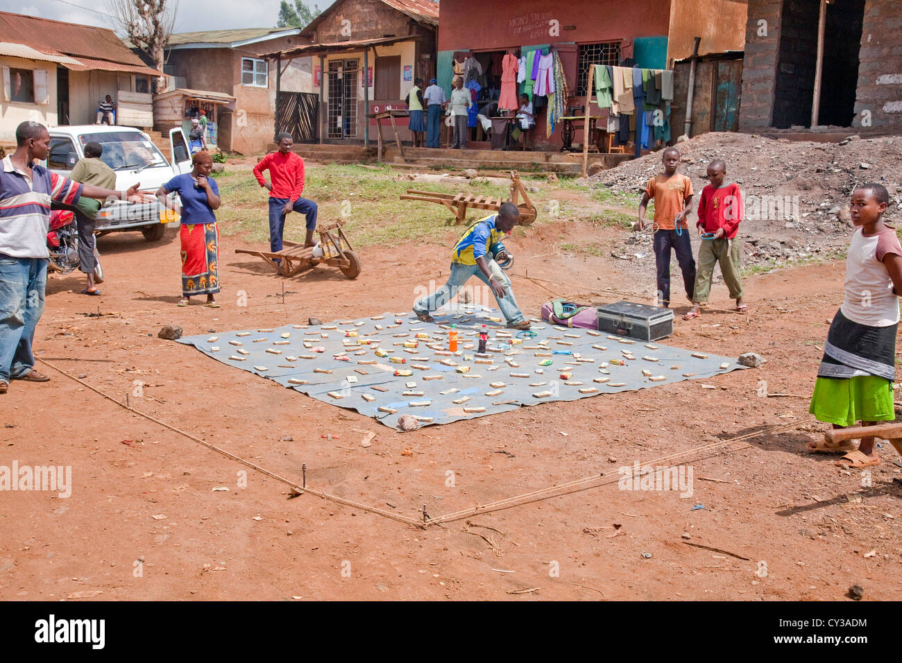 Young African Boys are playing a game of "Mchezo ea bahati nasibu" at ...