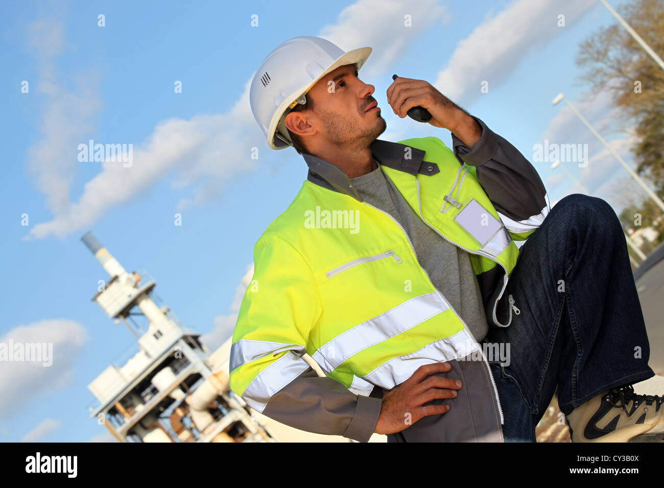Traffic guard speaking into his walkie talkie Stock Photo - Alamy