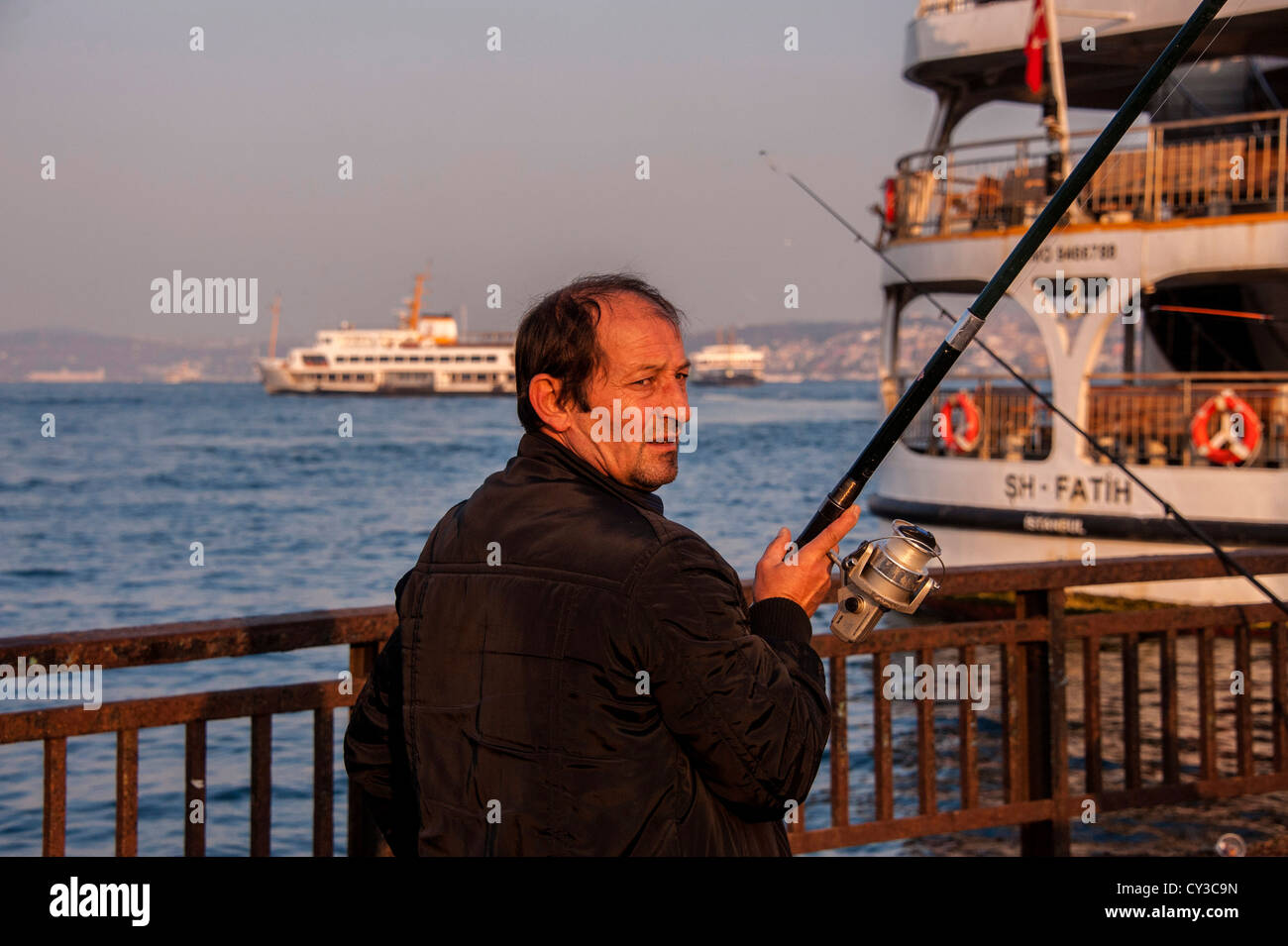 Fishing from the Galata Bridge in Istanbul Turkey Stock Photo - Alamy