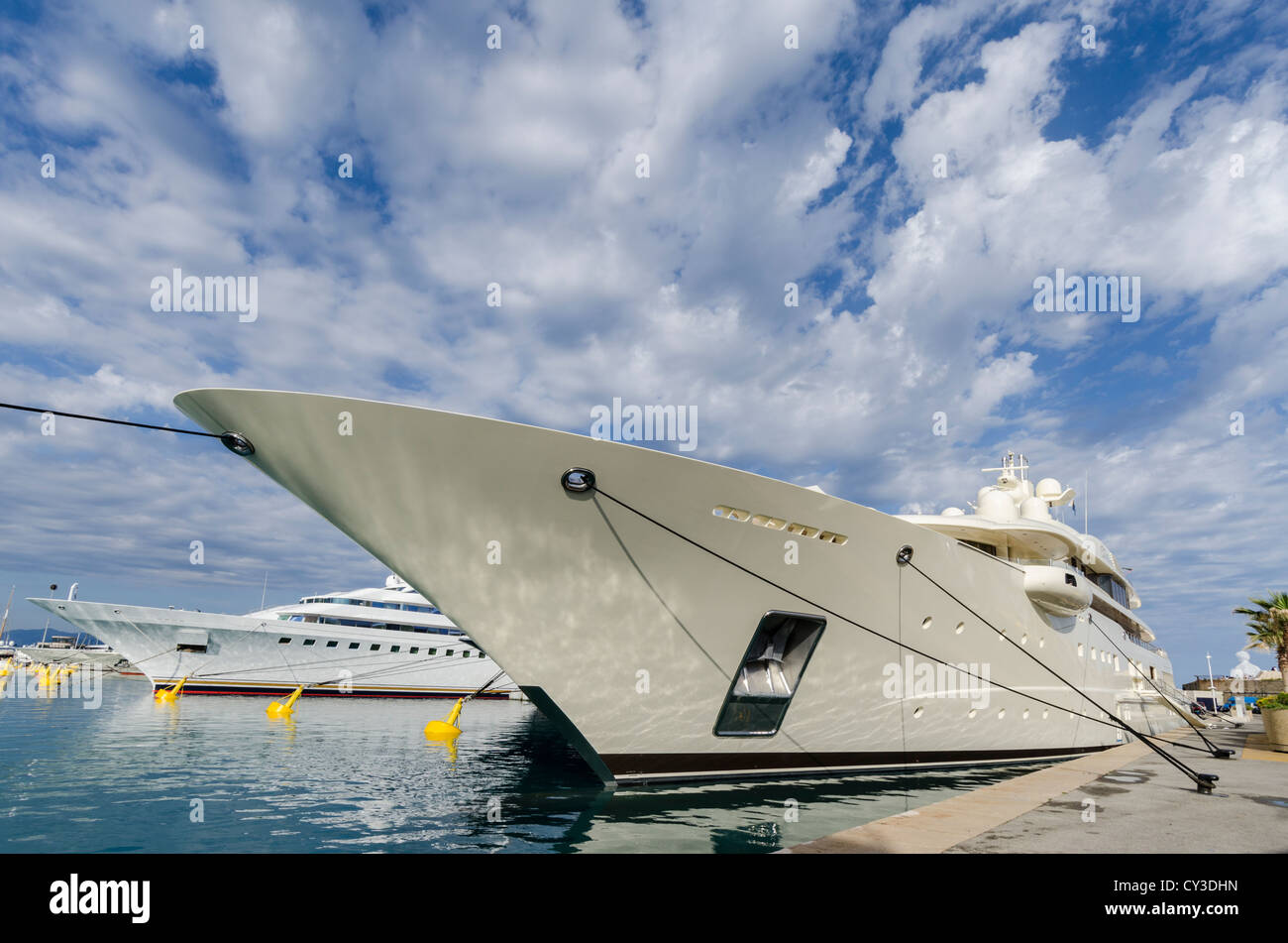 The Dilbar and other luxury yachts anchored in Antibes harbour, Cote d ...