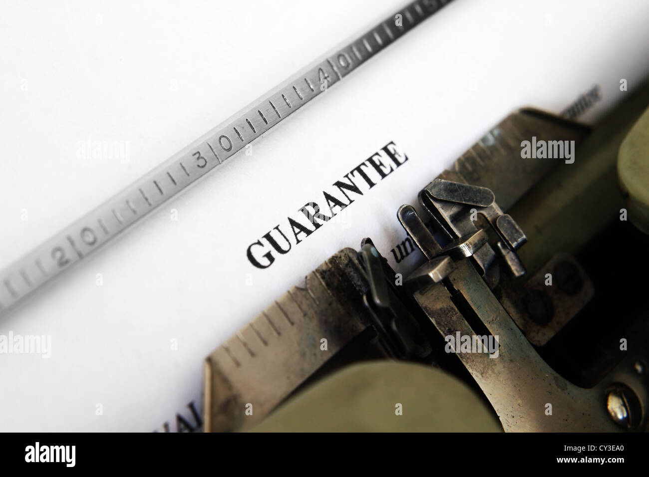 Guarantee text on typing machine Stock Photo - Alamy