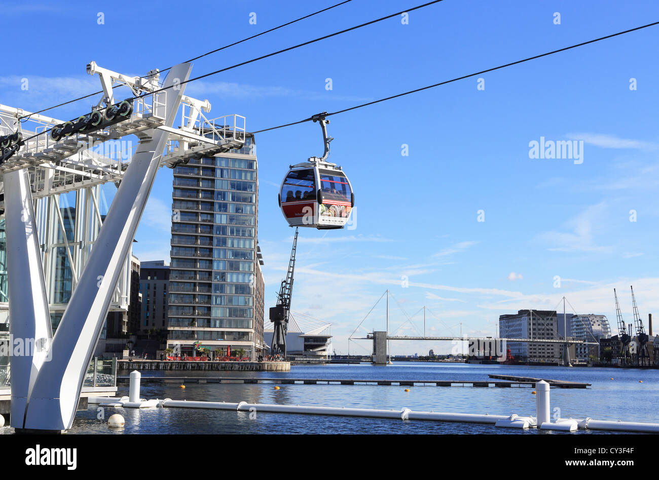 The Emirates Airline cable car leaving Royal Docks in Newham, east ...