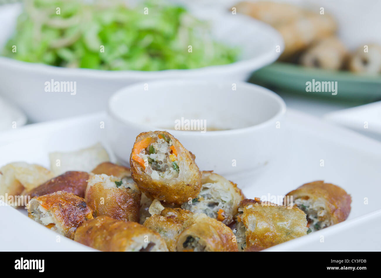 Chinese spring rolls on plate served with sweet sauce Stock Photo - Alamy