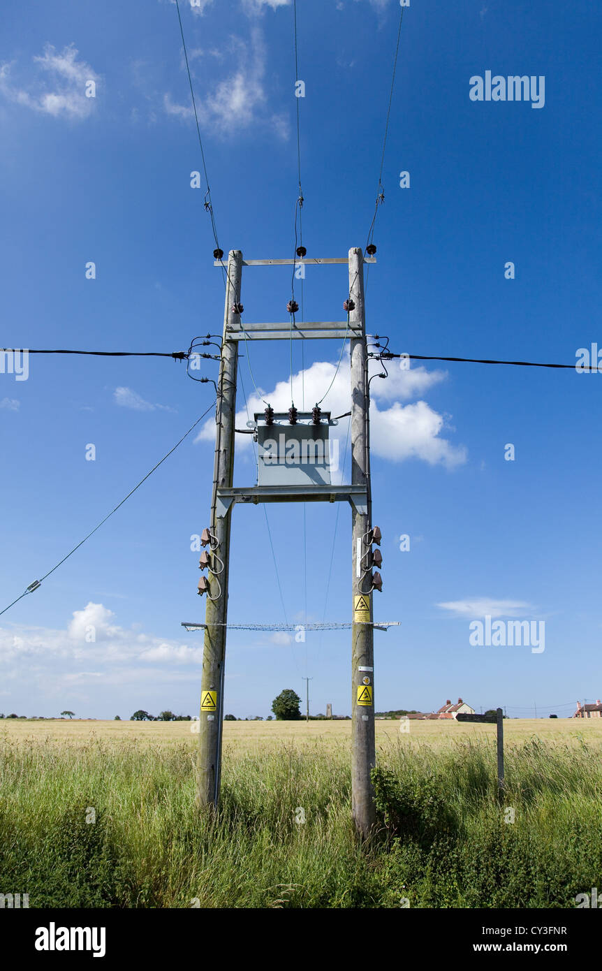 British wooden electricity pylon carrying distribution lines with pole ...
