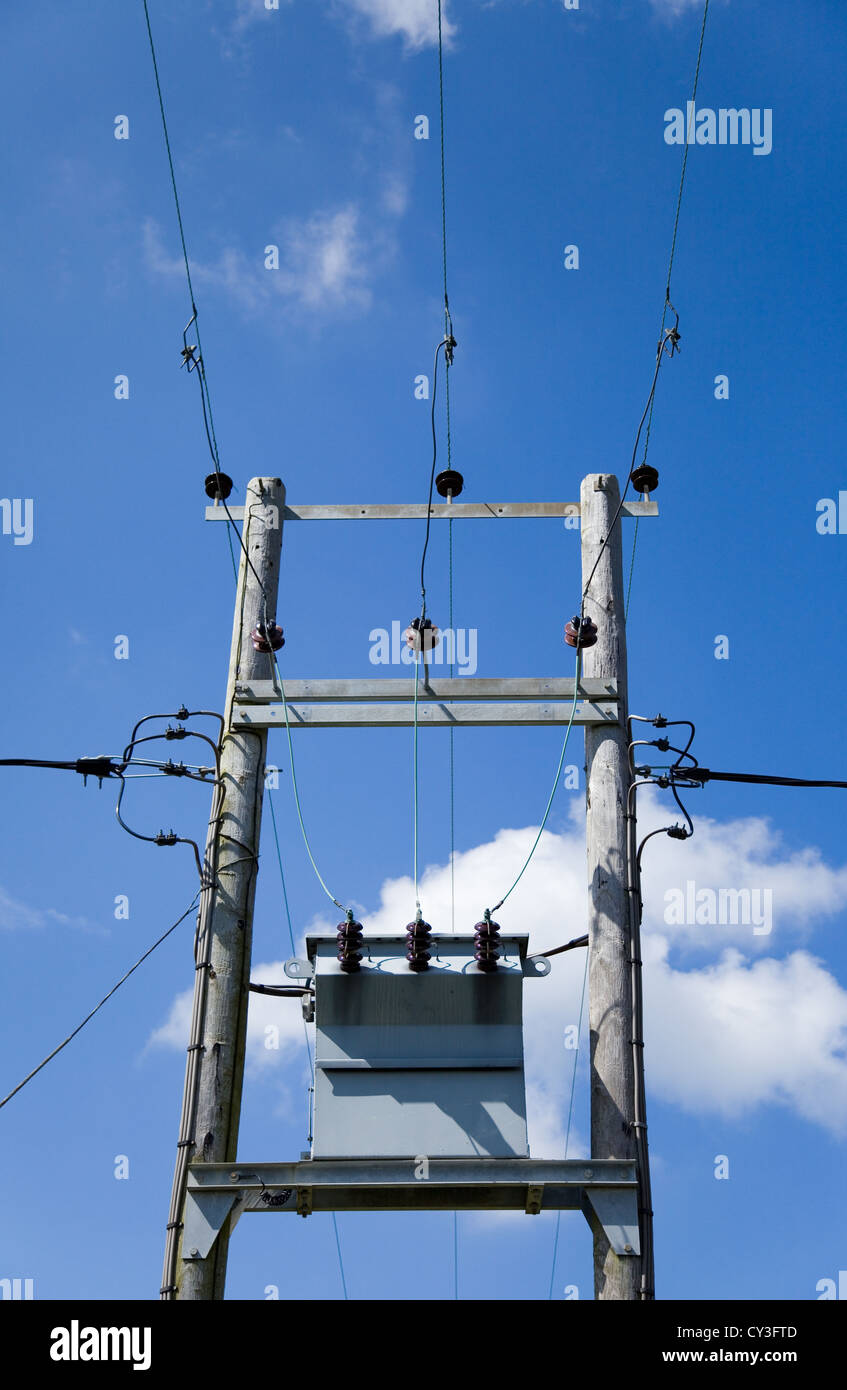 British wooden electricity pylon carrying distribution lines with pole ...