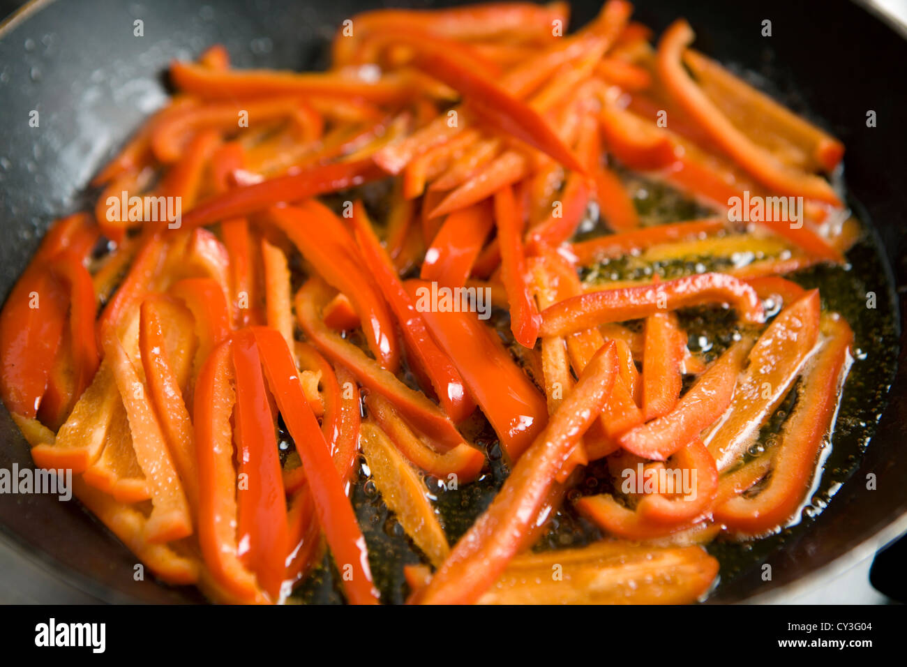 Frying pan sliced red peppers hi-res stock photography and images - Alamy