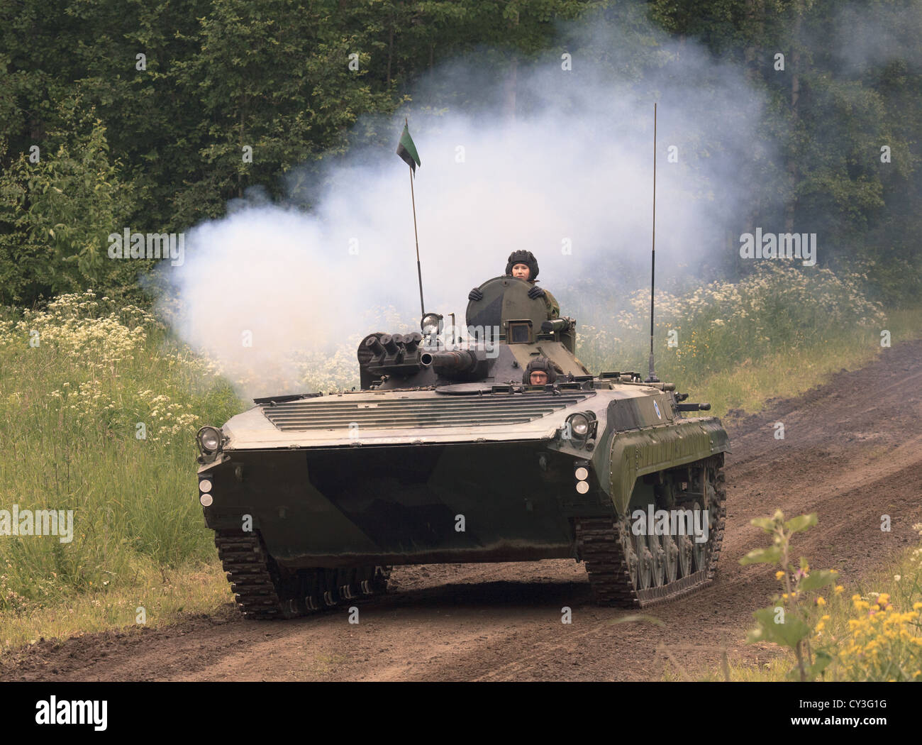 A Finnish Army BMP-2 infantry fighting vehicle revving its engine with ...