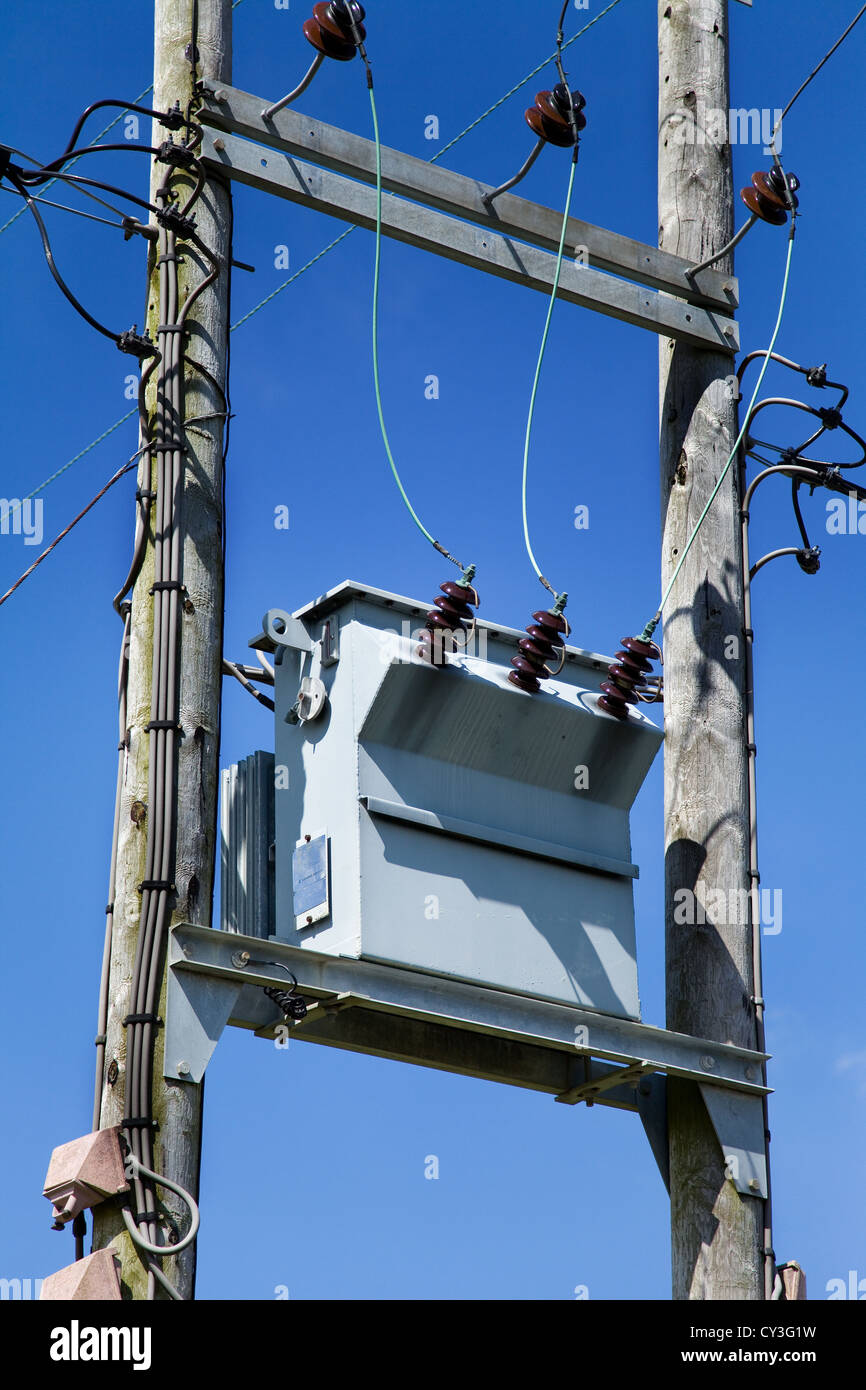 British wooden electricity pylon carrying distribution lines with pole ...