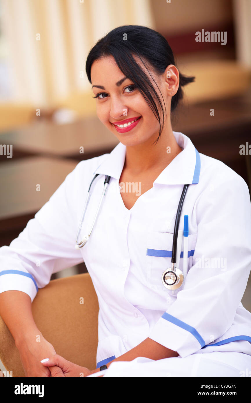 Medical latin doctor woman smiling indoors Stock Photo - Alamy