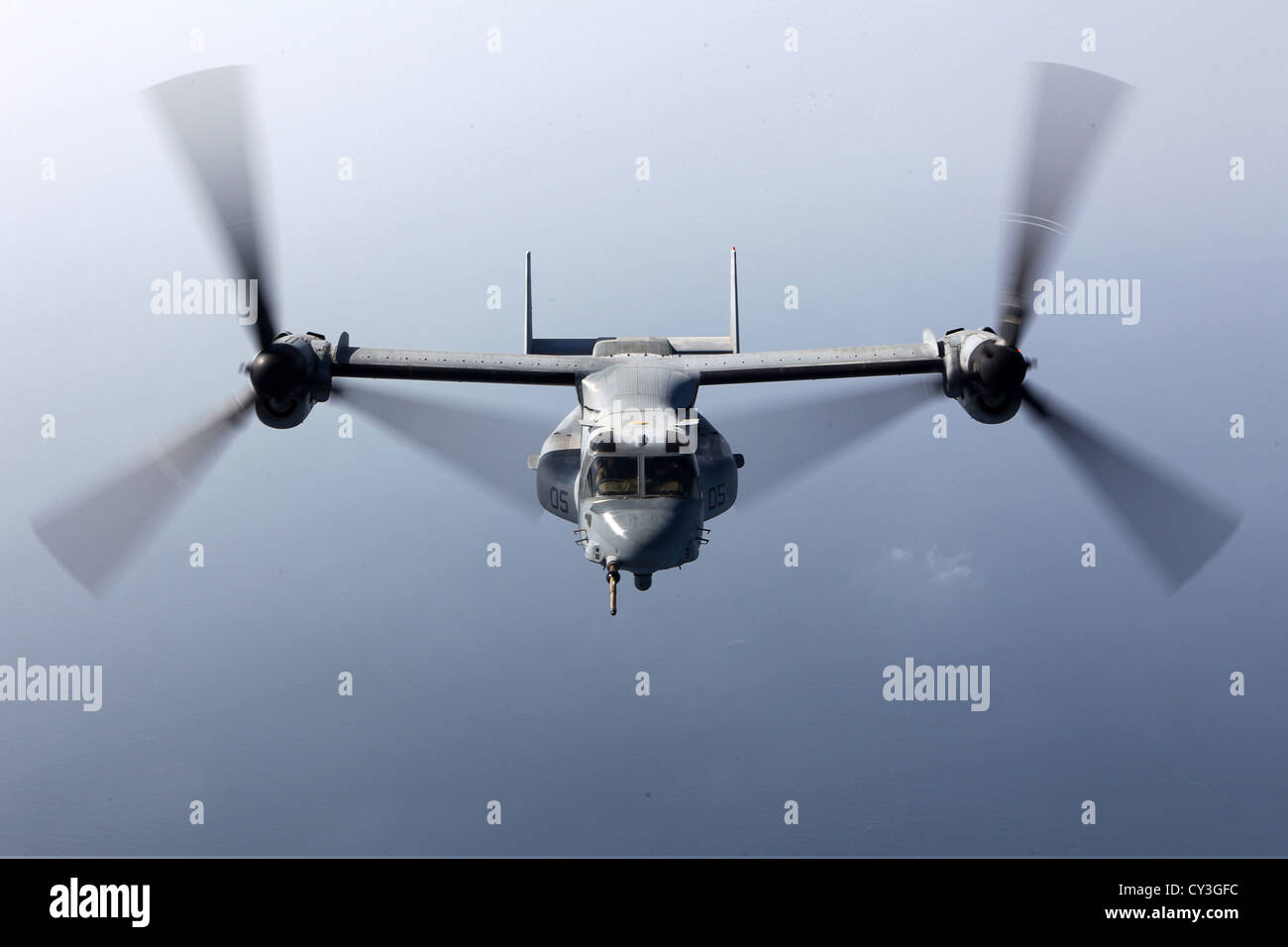A US Marine Corps MV-22B Osprey tilt rotor vertical lift aircraft flies ...