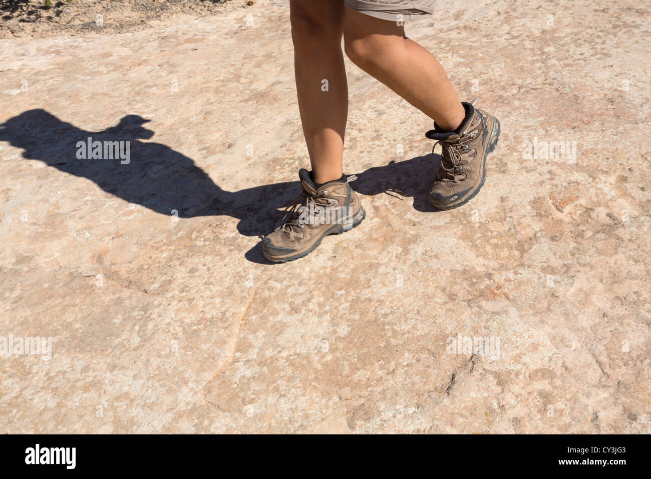 Hiker making steps on a trail wearing hiking boots Stock Photo - Alamy