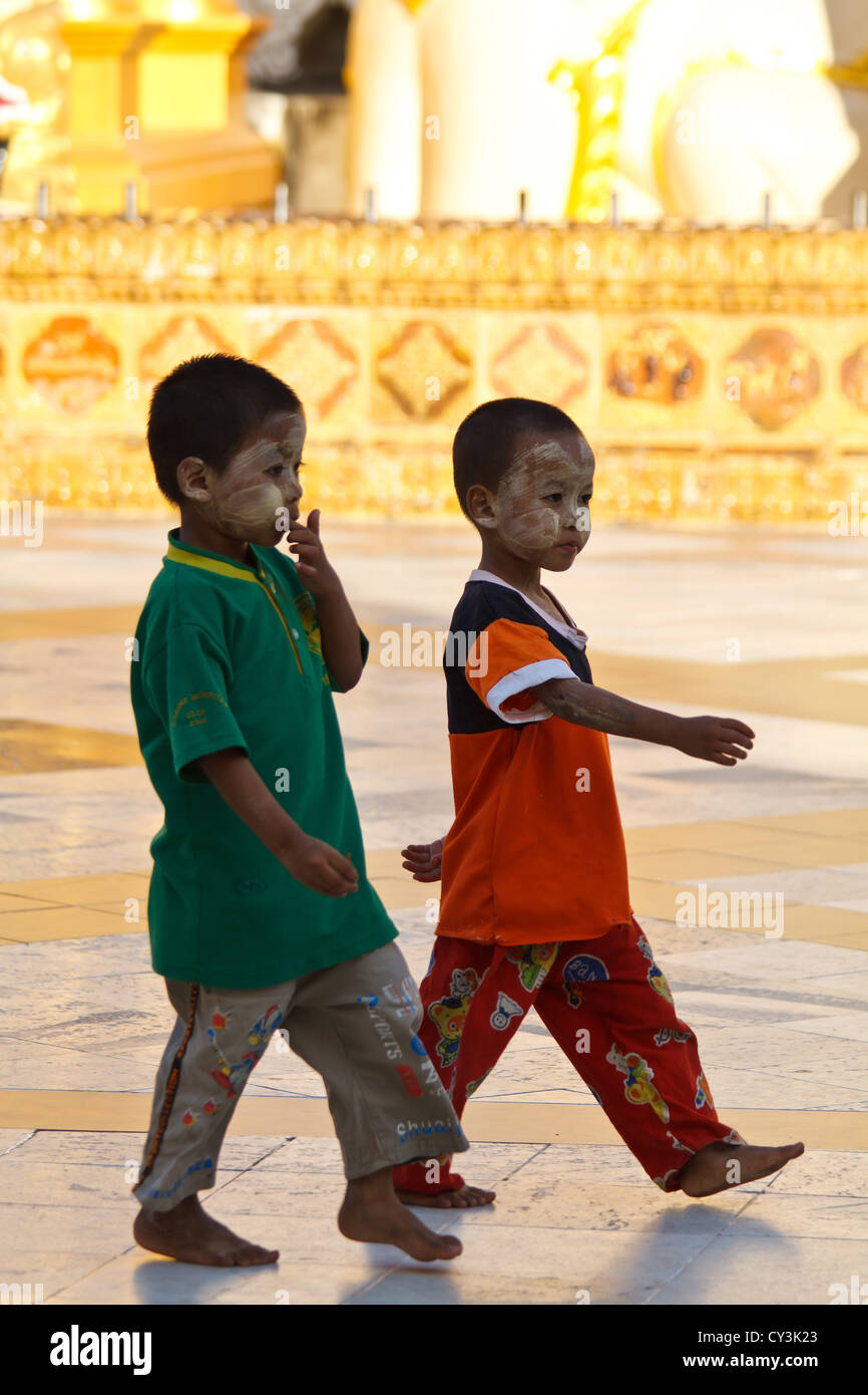 Little Boys walking through the Shwedagon Pagoda in Rangoon, Myanmar ...