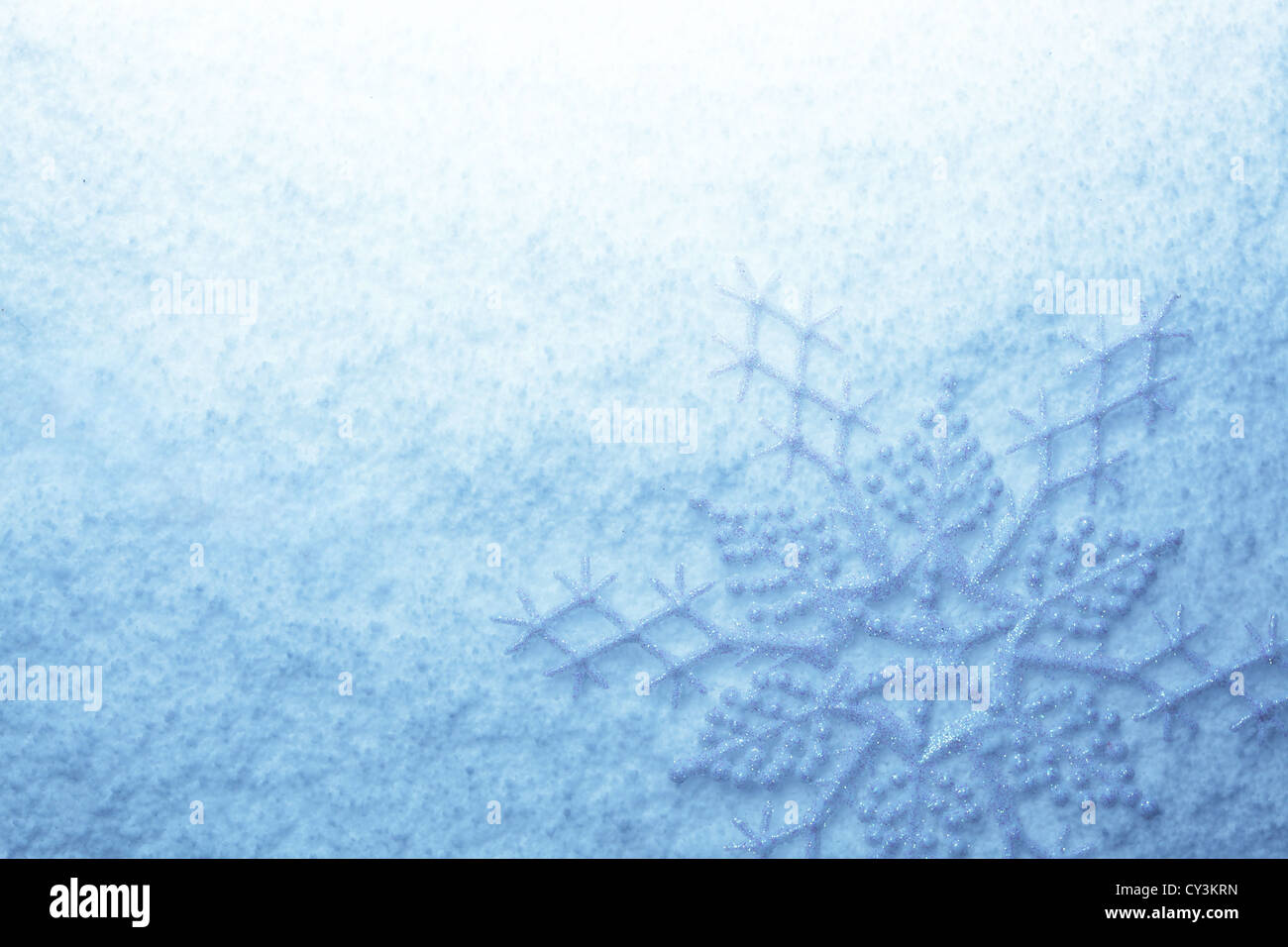 Snowflakes on snow Stock Photo - Alamy