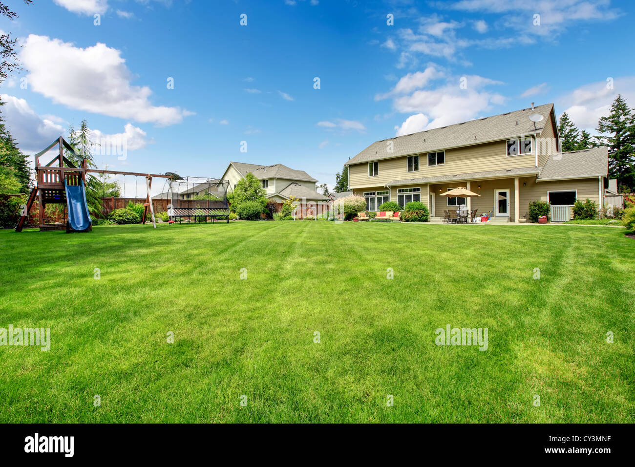 Large beautiful fenced backyard with play ground and nice house Stock ...