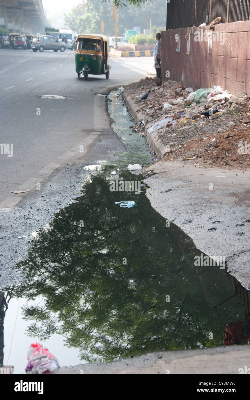 Human waste fills the curb side gutter of a New Delhi street Stock ...