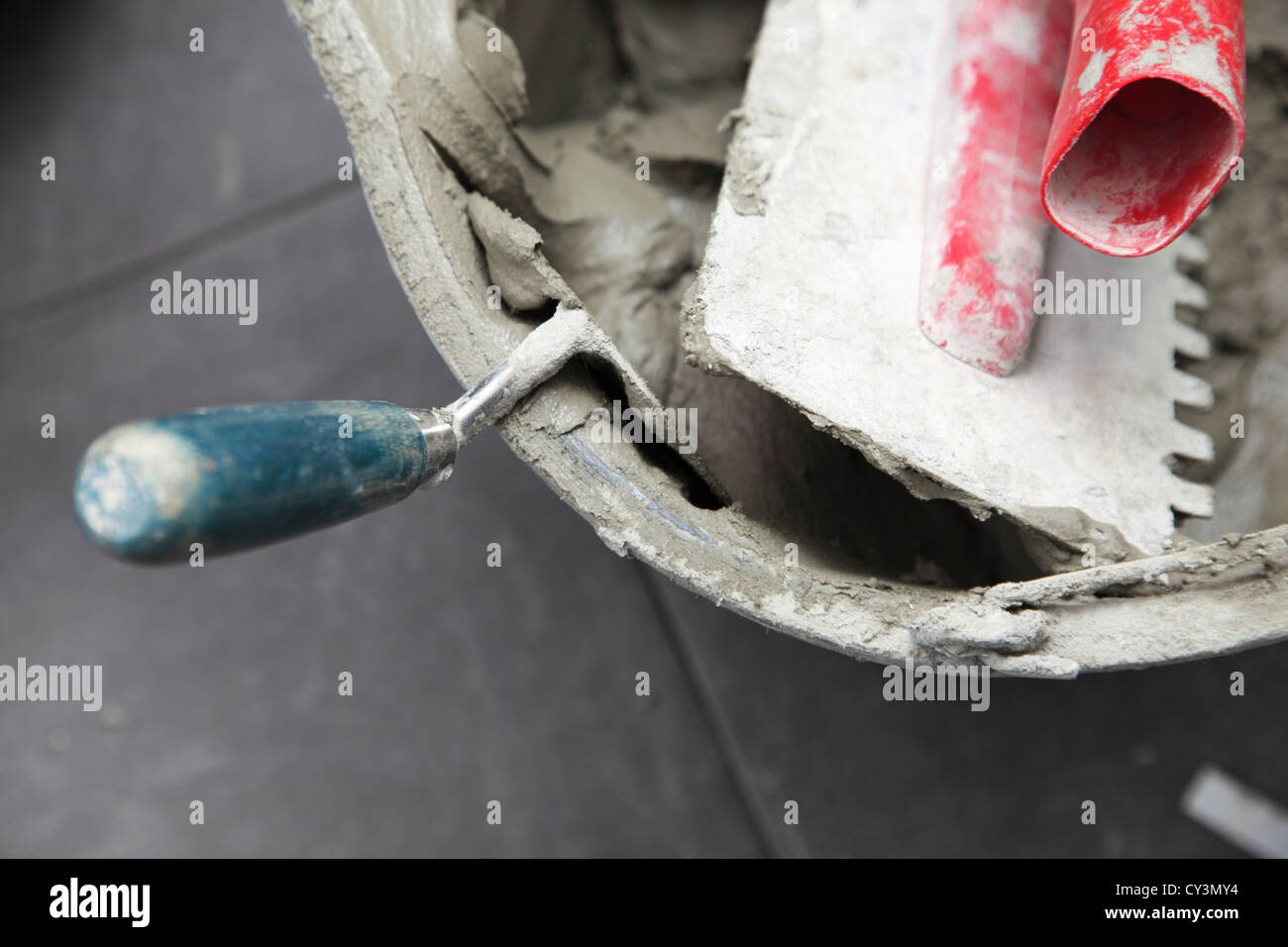 mortar on wall construction notched trowel work tools Stock Photo - Alamy