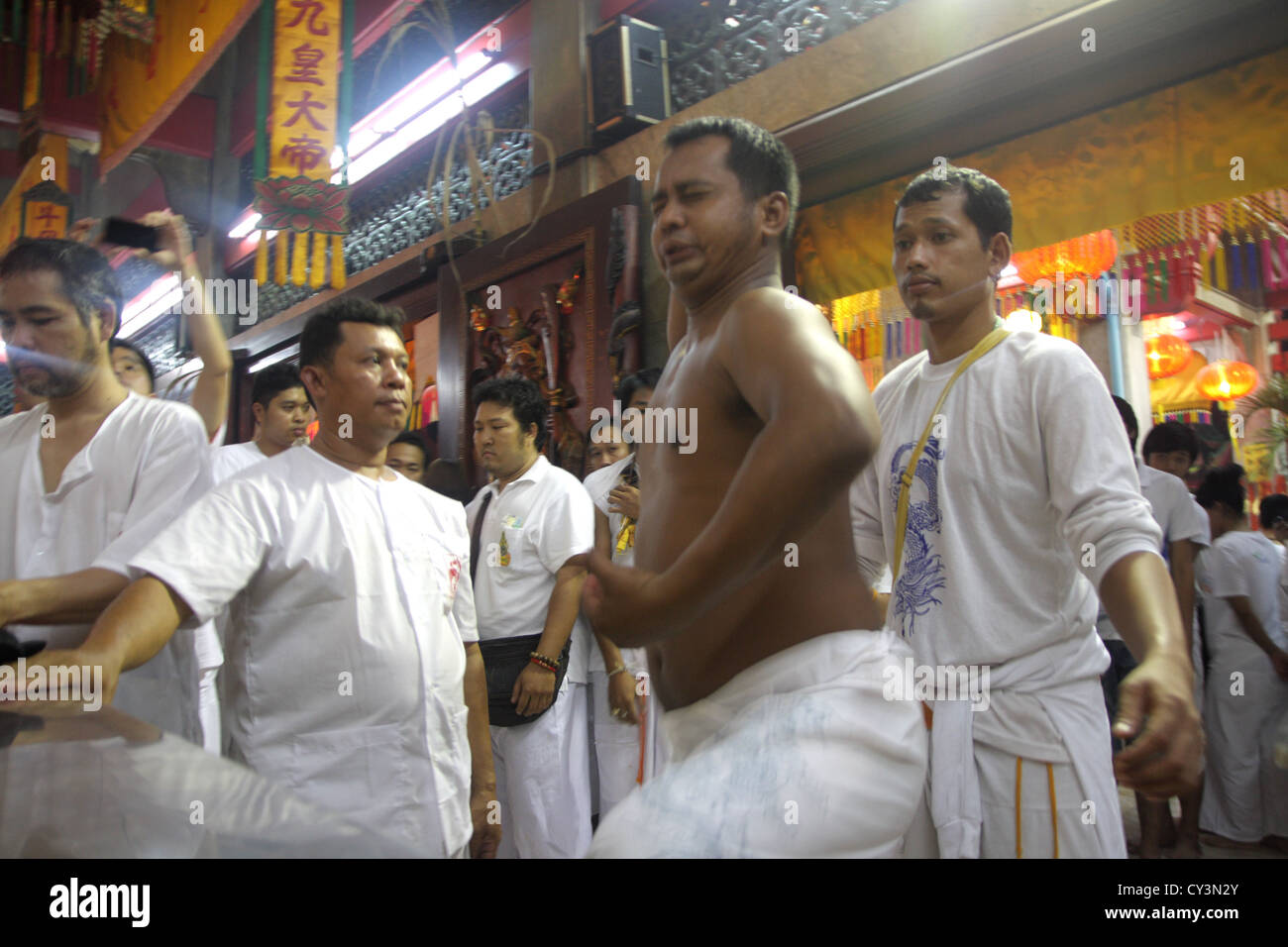 Devotees of the Chinese shrine of Jui Tui Shrine, go out of a trance as ...