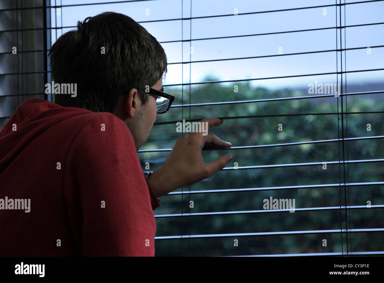 Man opening window blinds hi-res stock photography and images - Alamy