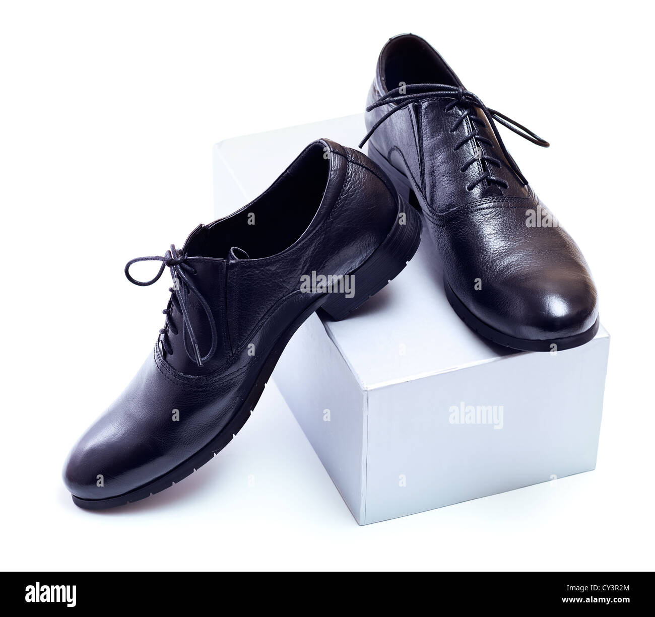 New black shoes with laces and grey box on a white background Stock ...