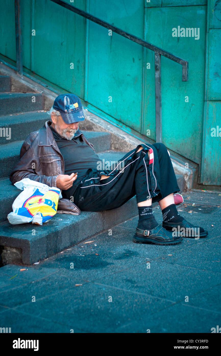 Poor man in germany, drinking and smoking after a long day's of work in ...