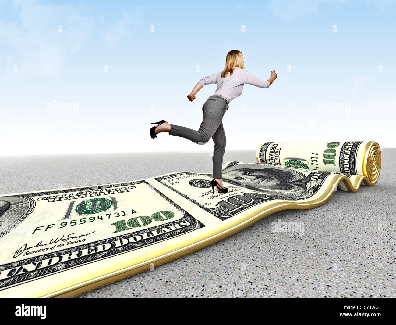 woman run on dollar carpet Stock Photo - Alamy