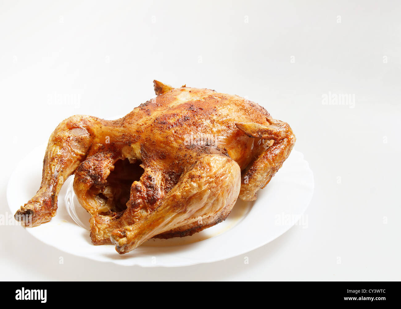 Roasted Chicken isolated on a white background Stock Photo - Alamy
