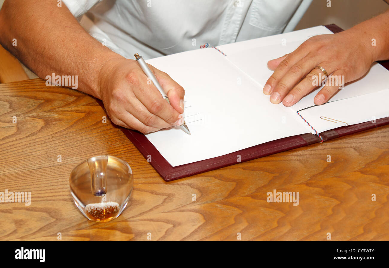 witness signing marriage license or wedding contract in wedding book ...