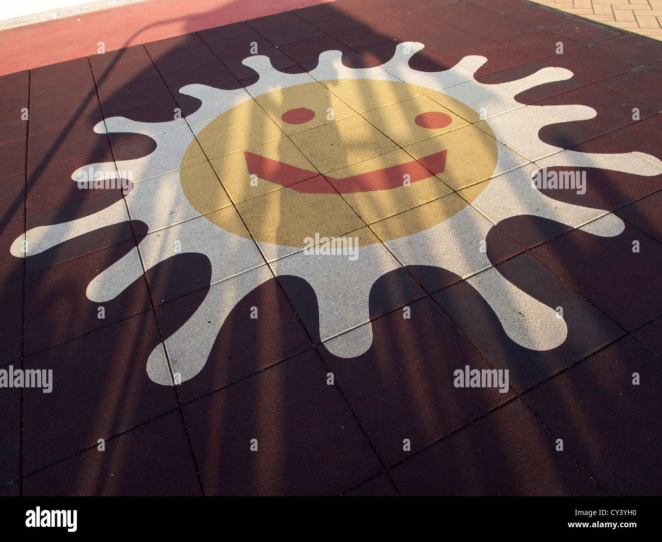 Happy face on a playground Stock Photo - Alamy