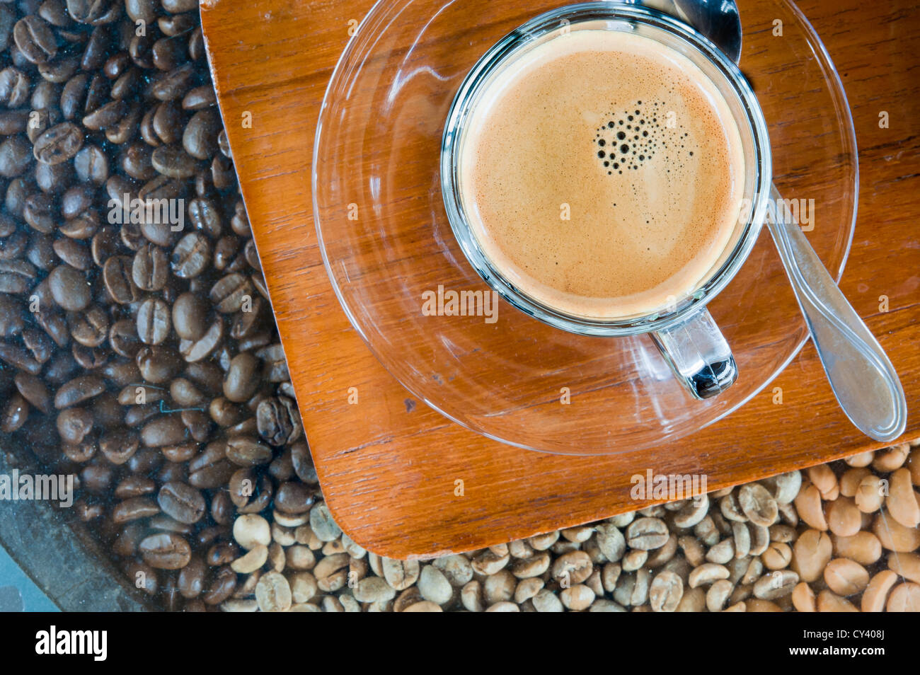 coffee cup on coffee beans background Stock Photo - Alamy