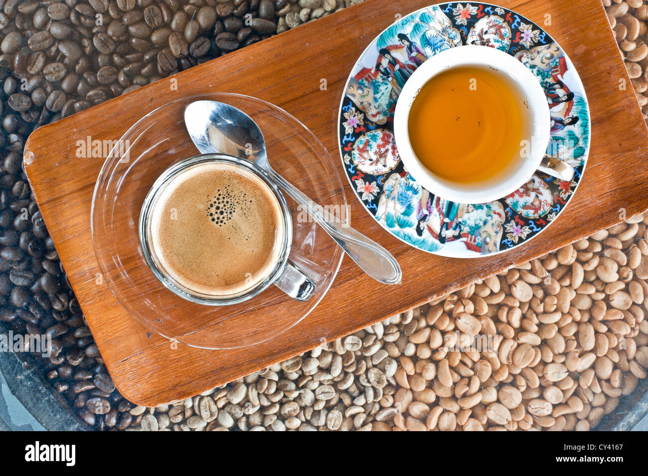 coffee cup on coffee beans background Stock Photo - Alamy