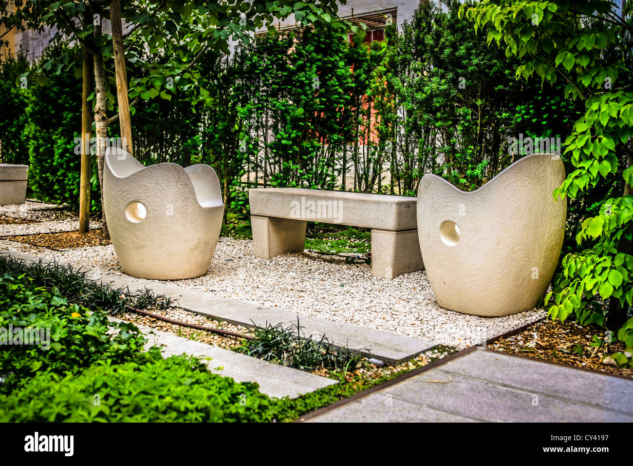 Outdoor seating in the Library gardens in Udine Italy Stock Photo - Alamy