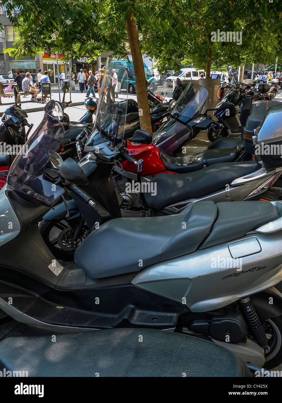 A typical scene - Barcelona commuter scooters mopeds parked on the ...