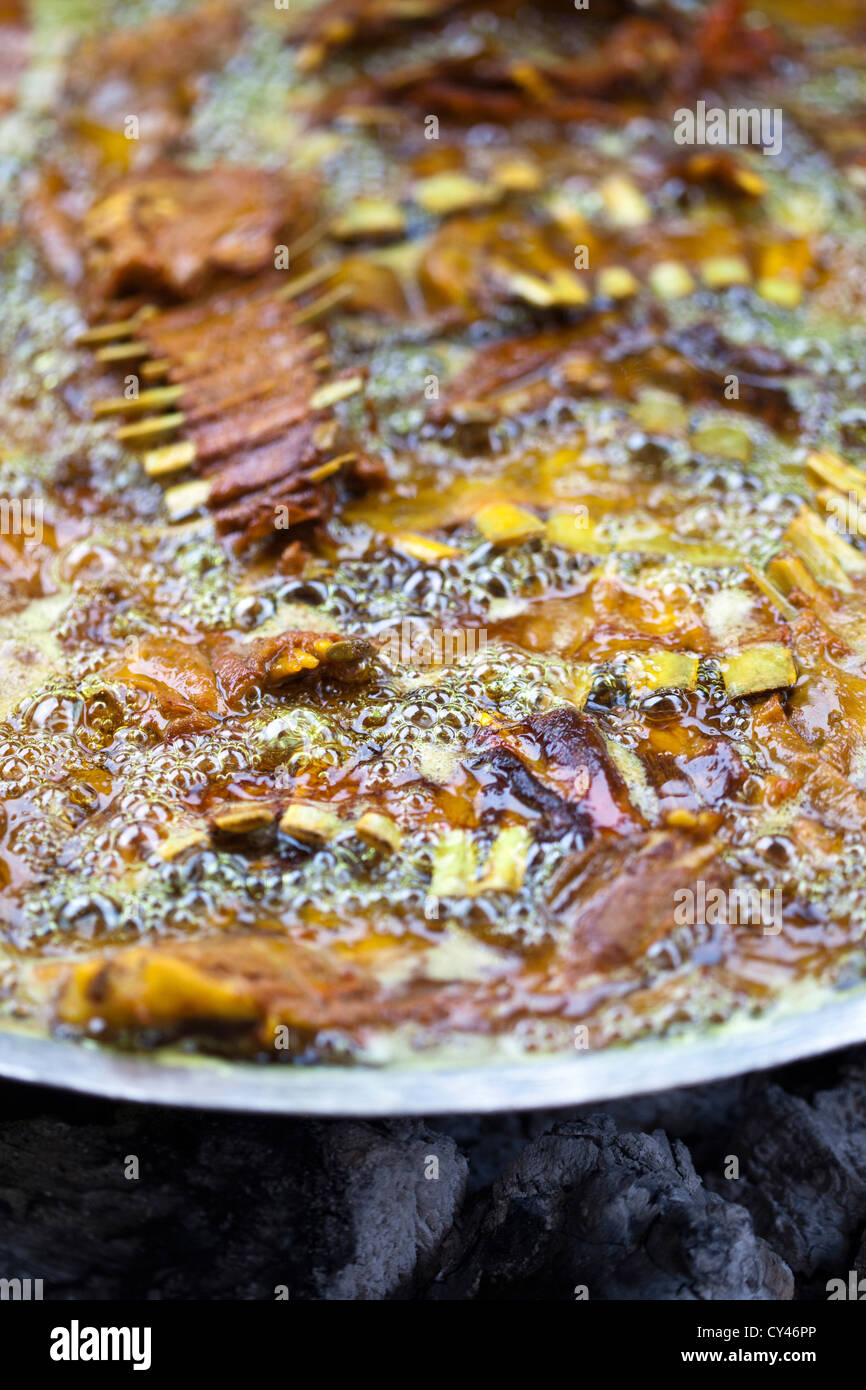 Detail of the dish Tabakh Maaz - lambs ribs - cooking in a pan at a ...