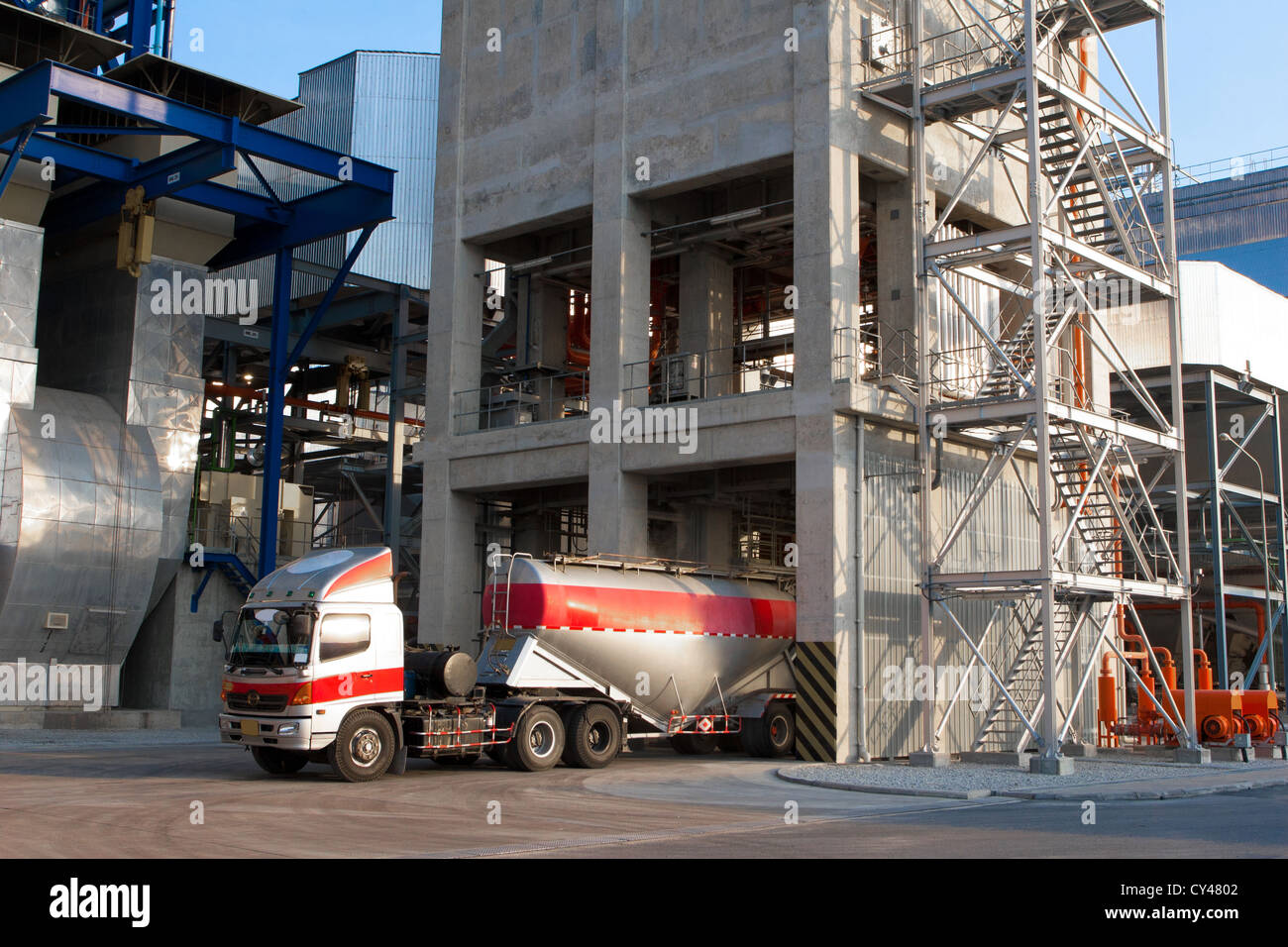heavy truck is loading the concrete powder to the packing factory Stock ...