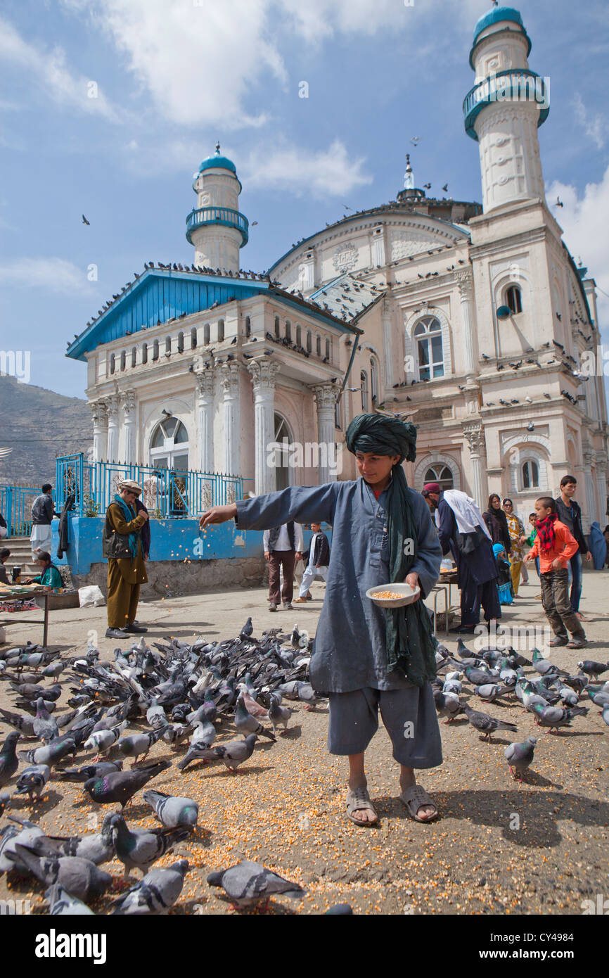 Afghan boy in front of a shia mosque in kabul Stock Photo - Alamy