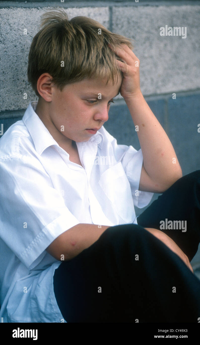 8 year old boy looking depressed/sad, London, UK Stock Photo - Alamy