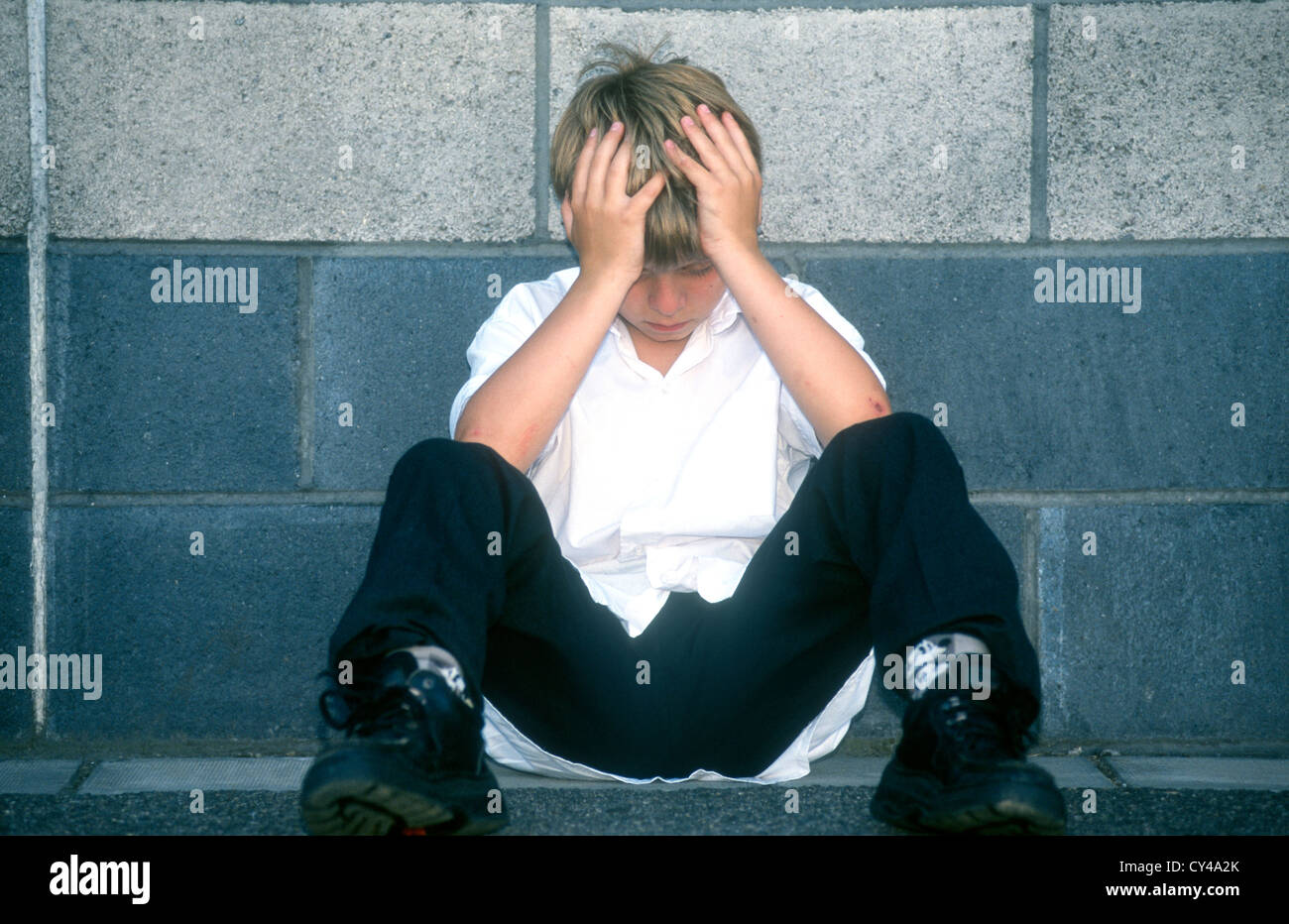 8 year old boy looking depressed/sad, London, UK Stock Photo - Alamy