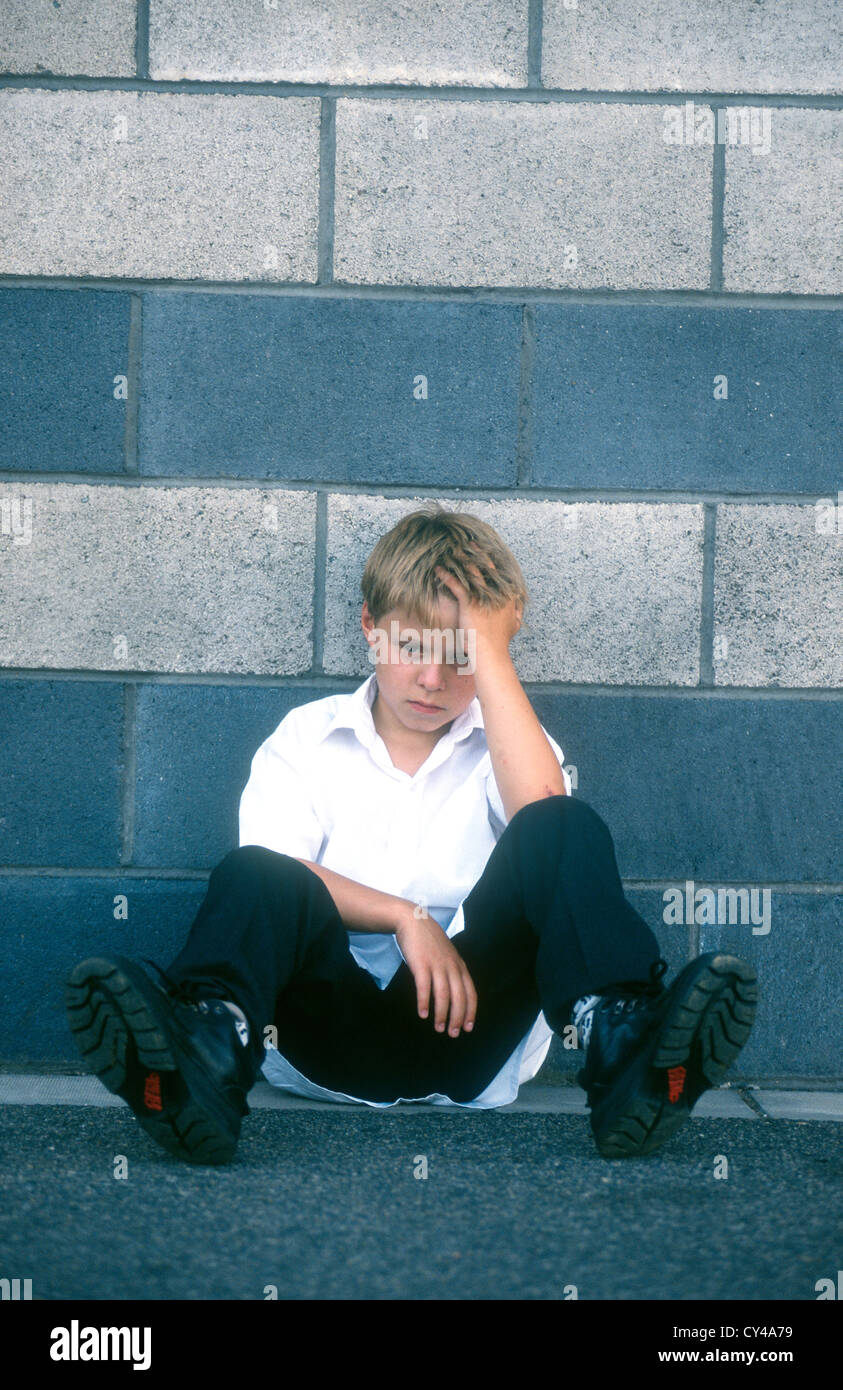 8 year old boy looking depressed/sad, London, UK Stock Photo - Alamy