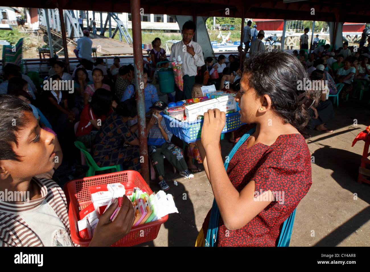 Girl selling Cigarettes on a Ferry Boat in Rangoon, Myanmar Stock Photo ...