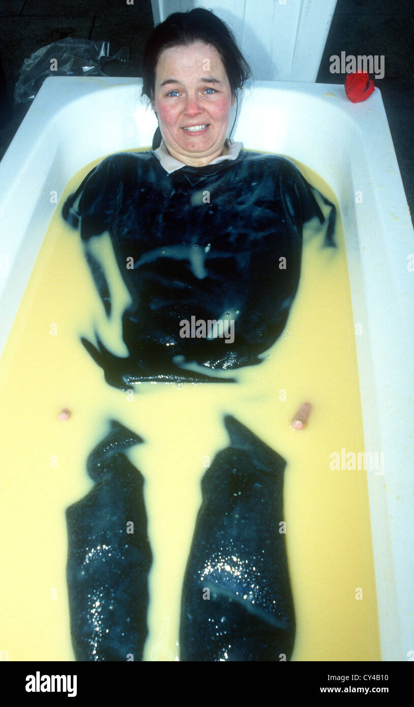Raising money for Comic Relief by lying in a bath of custard Stock ...
