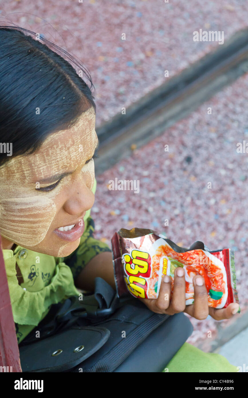 Young Girl with traditional Thanaka Make-Up in her Face in Rangoon ...