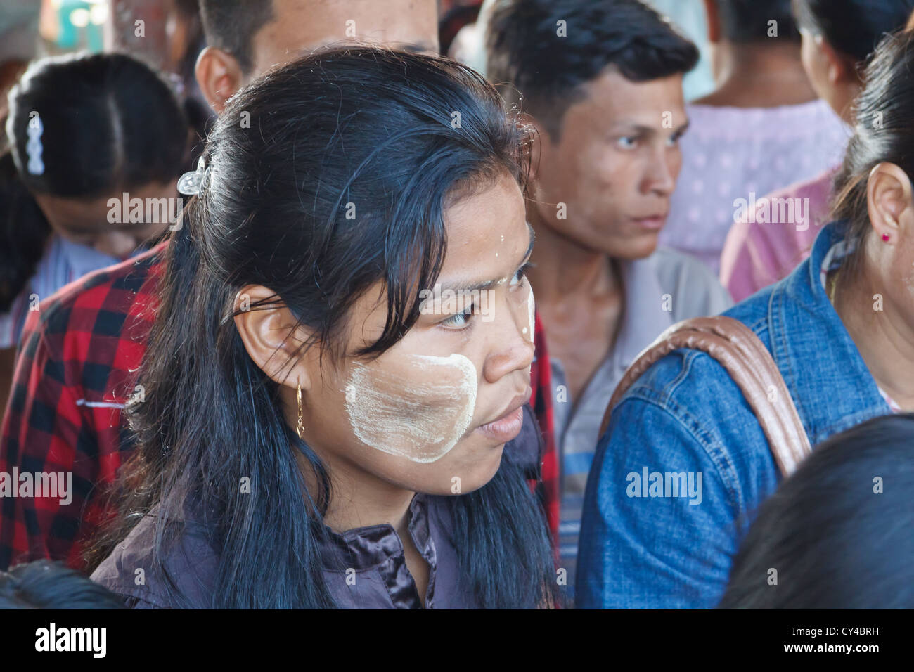 Woman with traditional Thanaka Make-Up in her Face in Rangoon, Myanmar ...